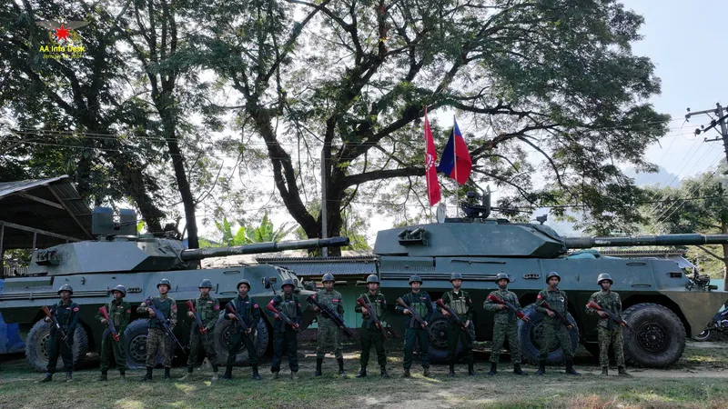 The Arakan Army (AA) exhibits a large volume of arms and ammunition ...